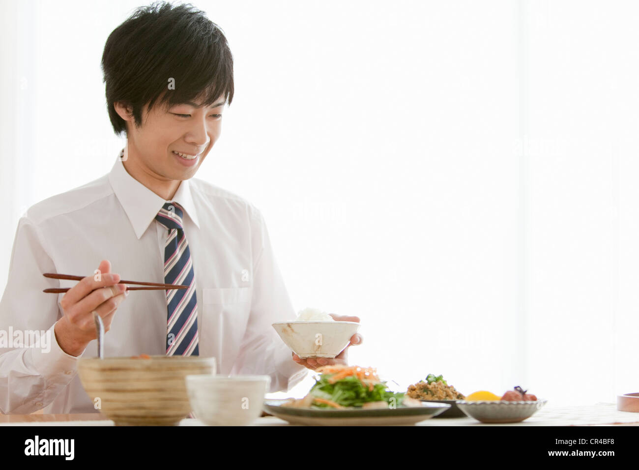 Young Man Eating Breakfast Stock Photo - Alamy
