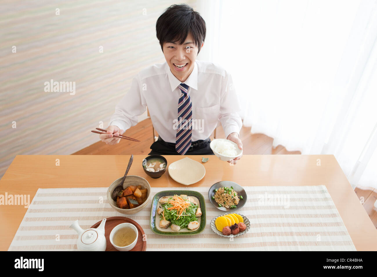 Young Man Having Breakfast Stock Photo - Alamy