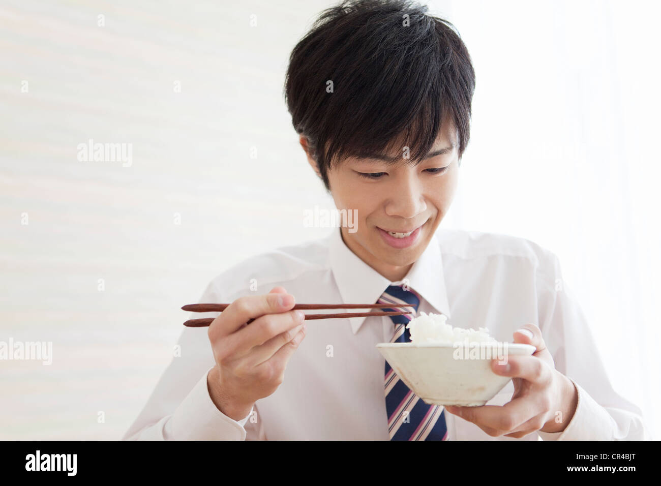 Man eating bowl rice chopsticks hi-res stock photography and images - Alamy