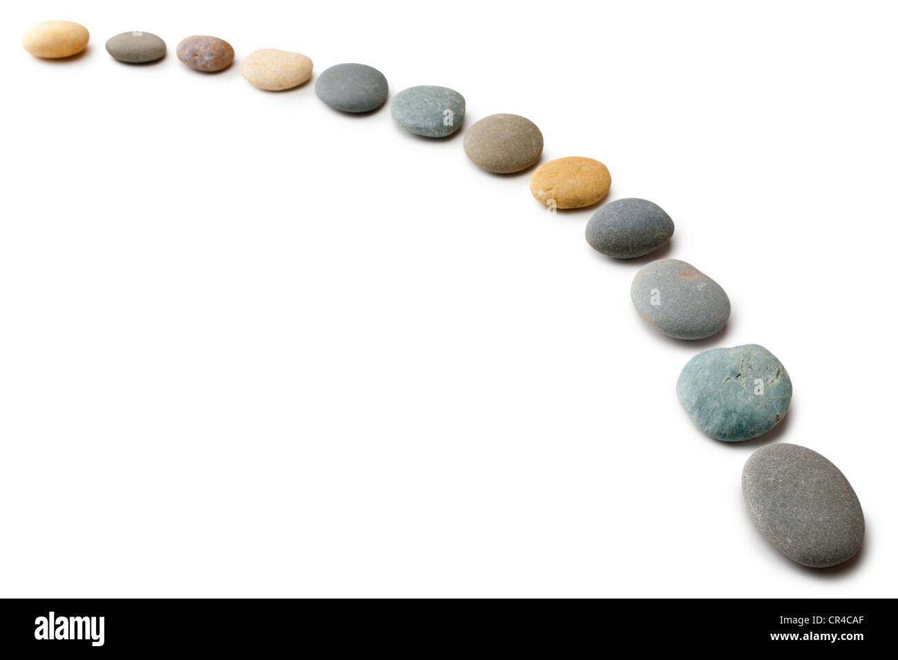 Snaking line of twelve coloured pebbles isolated on white Stock Photo ...