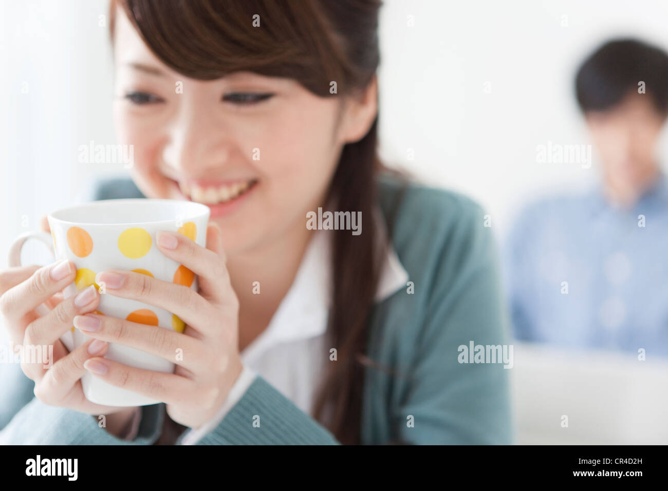 Young Woman Having Tea Stock Photo - Alamy