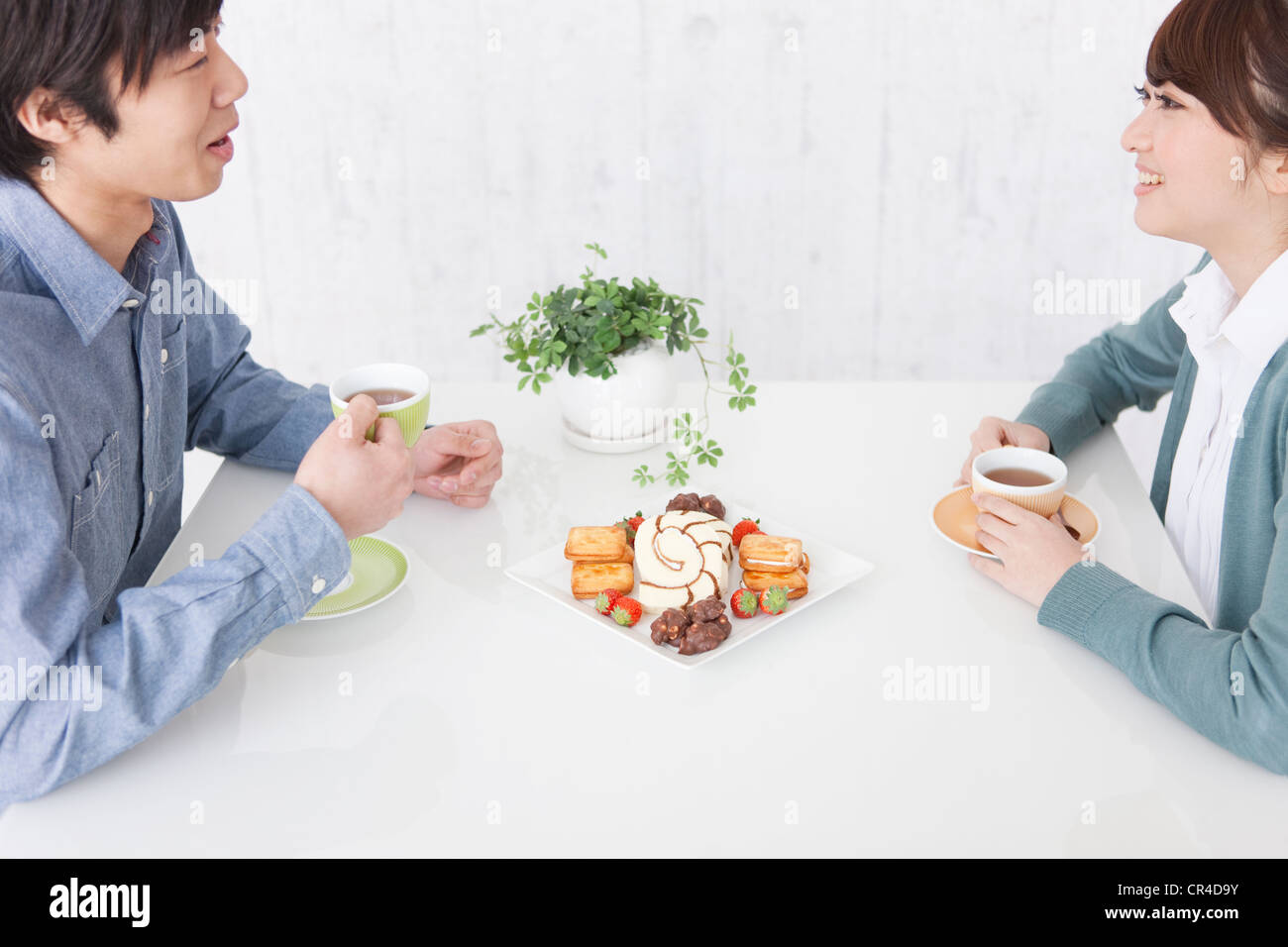Young Couple Having Snack Stock Photo - Alamy