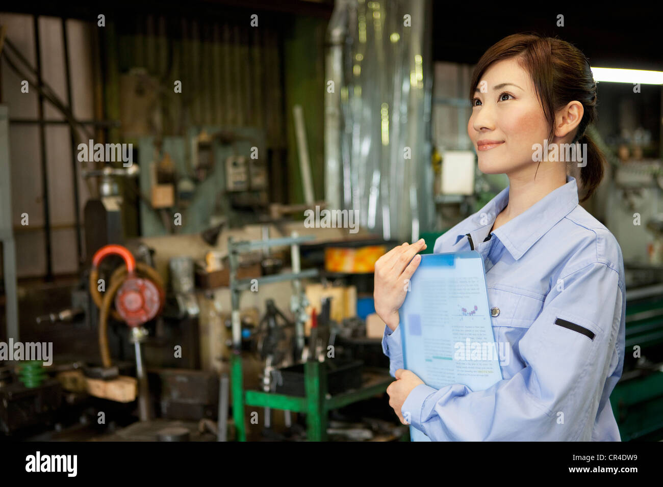 Young Woman In Factory Stock Photo - Alamy