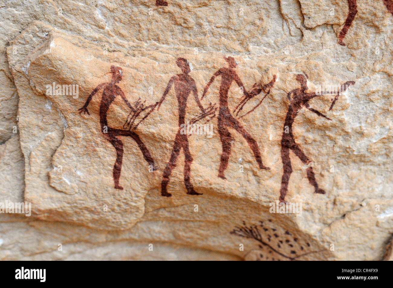 Group of painted warriors or hunters, neolithic rock art at Arakokem ...