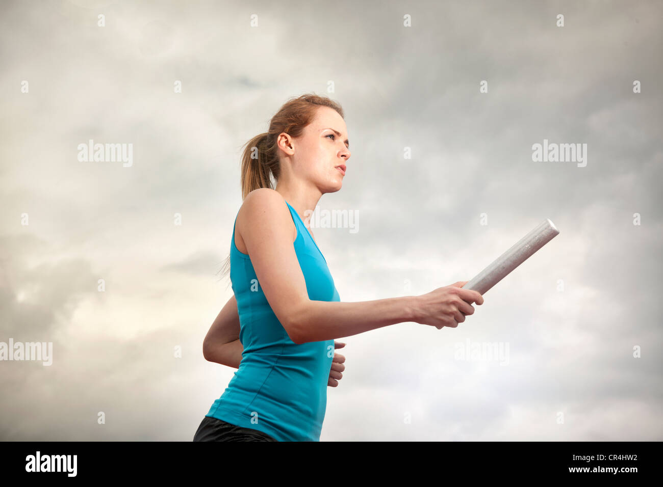 woman passing relay baton Stock Photo - Alamy