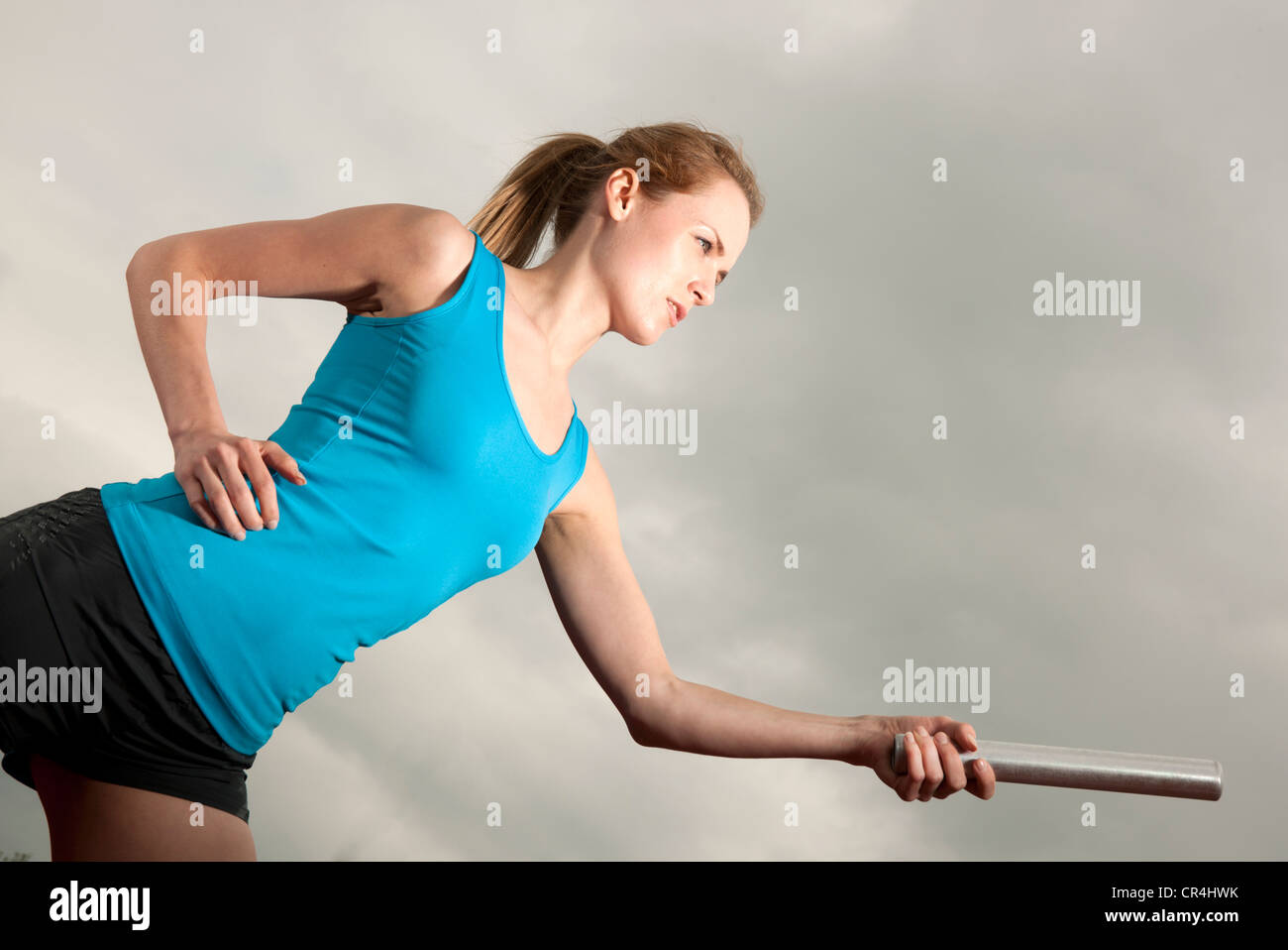 woman passing relay baton Stock Photo - Alamy