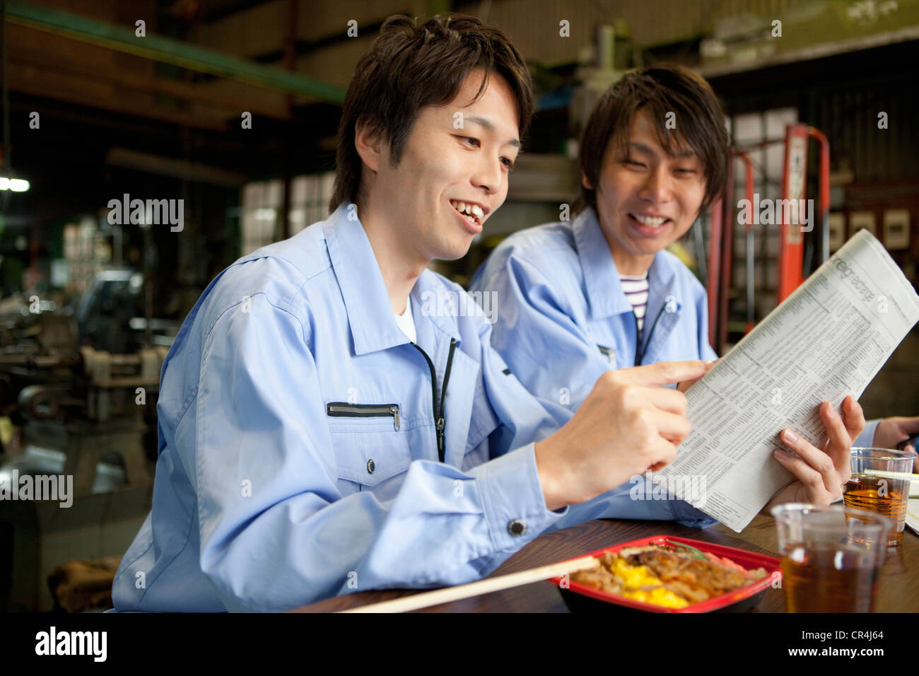Two Male Factory Workers on Lunch Break Stock Photo - Alamy