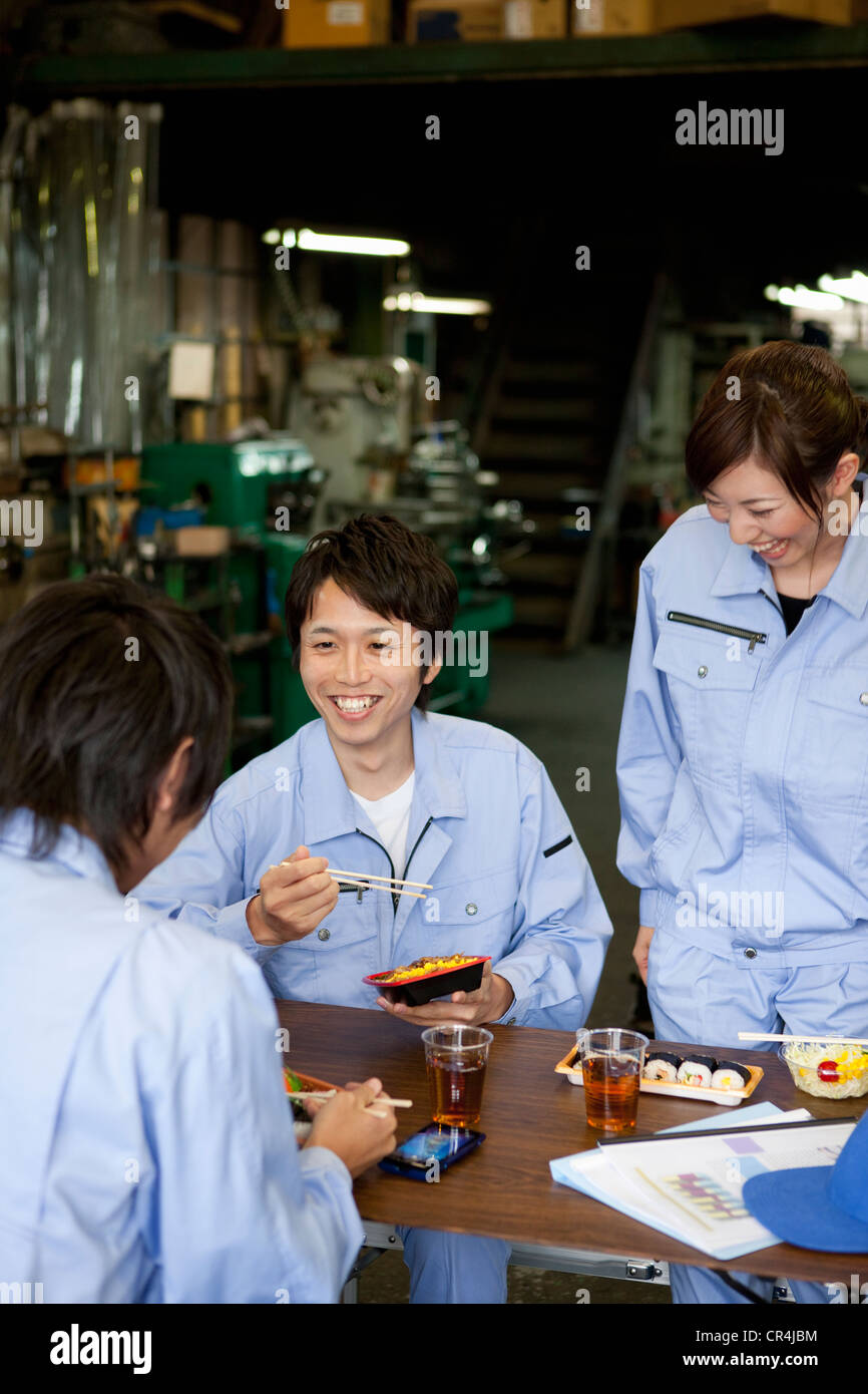 Three Factory Workers Having Lunch Break Stock Photo - Alamy