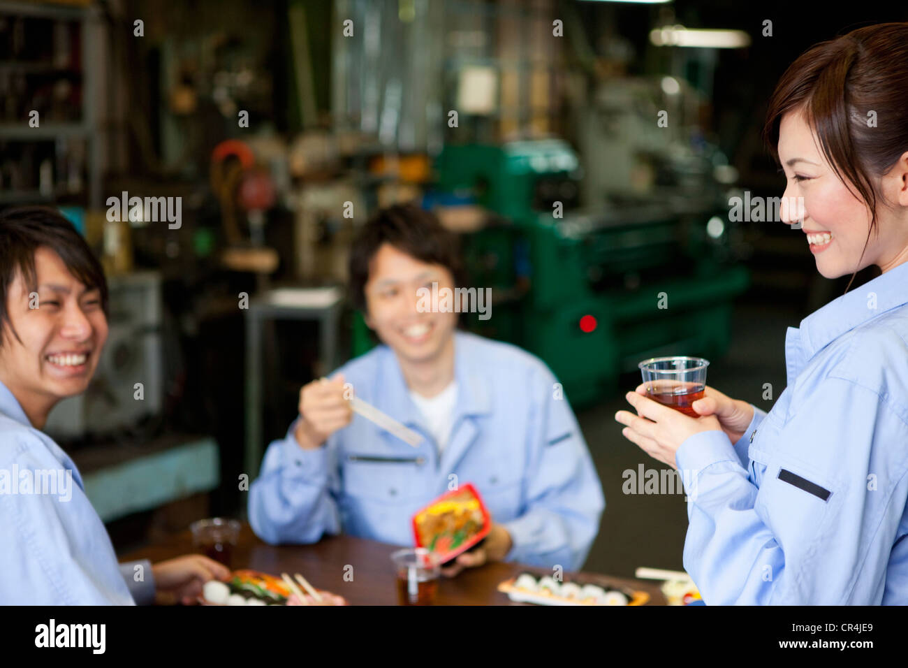 Three Factory Workers Having Lunch Break Stock Photo - Alamy