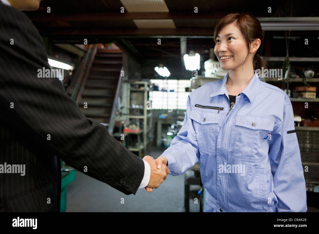 Young Woman Shaking Boss'S Hand Stock Photo - Alamy