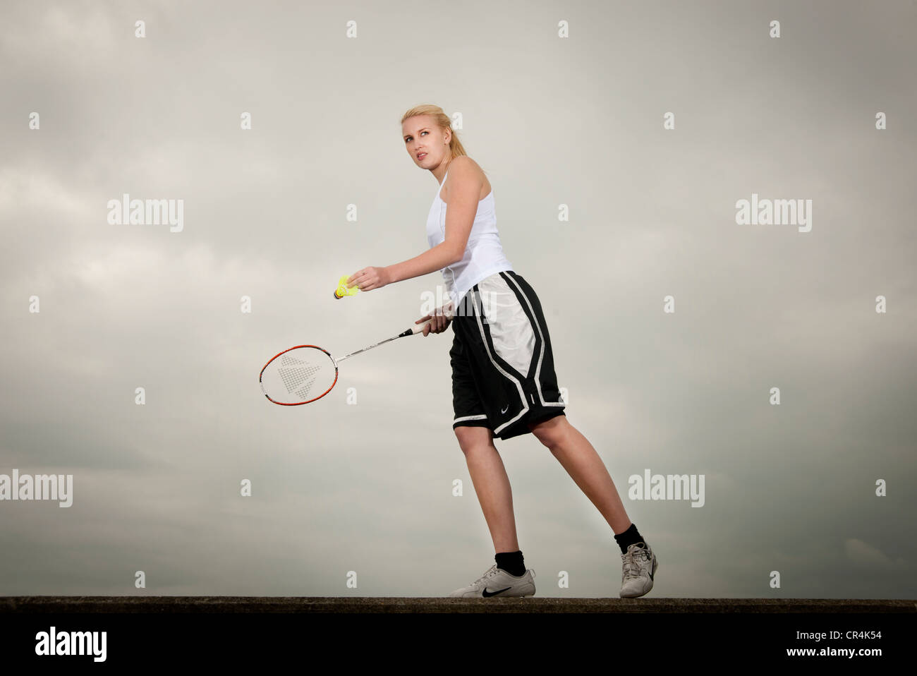 woman playing badminton Stock Photo - Alamy