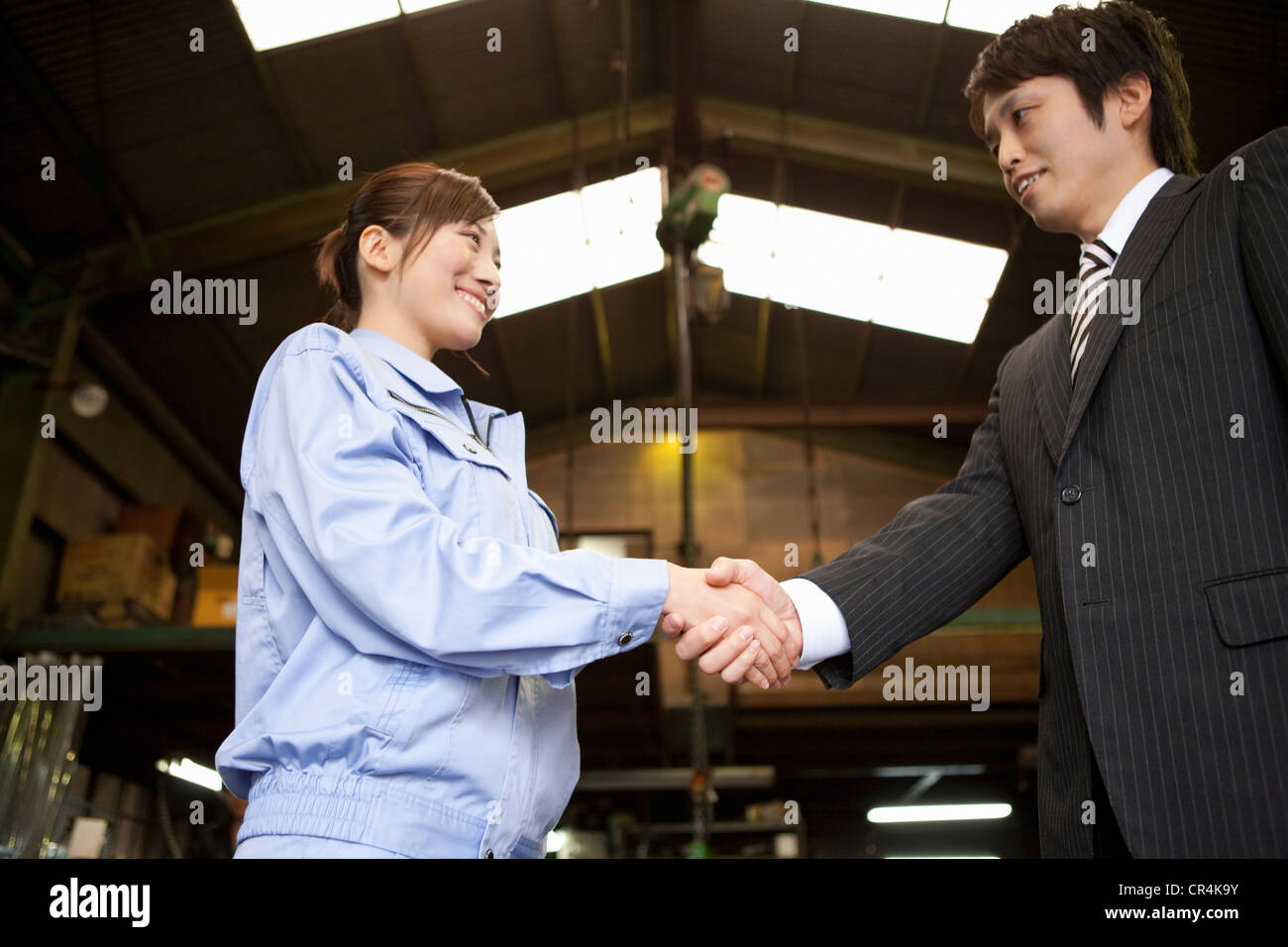 Young Woman Shaking Boss'S Hand Stock Photo - Alamy