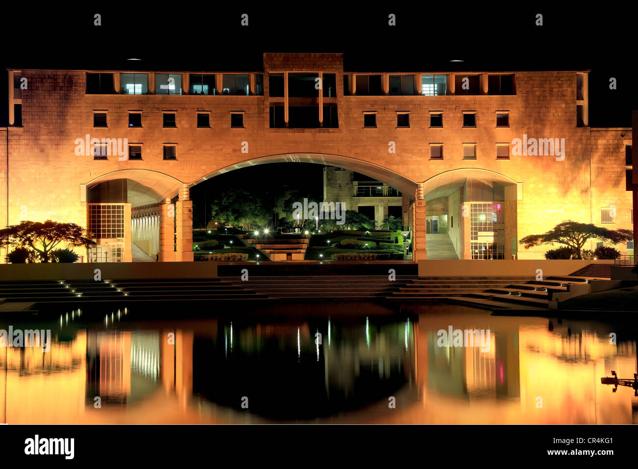 Over the lake at night to campus buildings at local university Stock ...