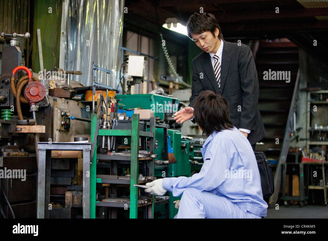 Male Worker Talking to Boss Stock Photo - Alamy