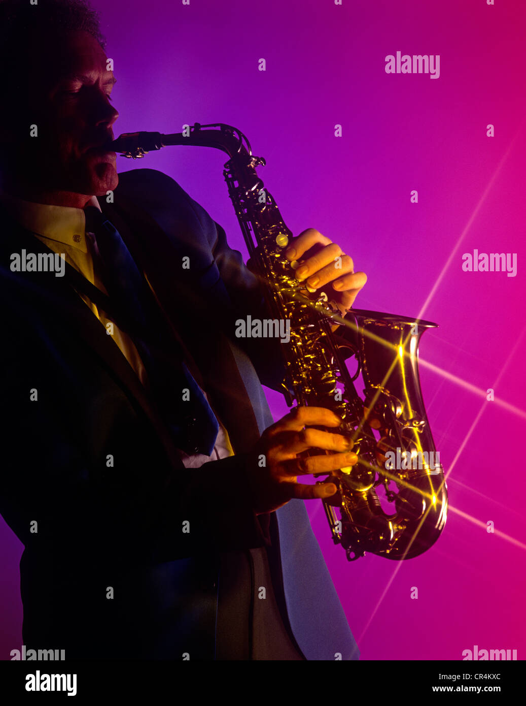 Boy playing saxaphone hi-res stock photography and images - Alamy