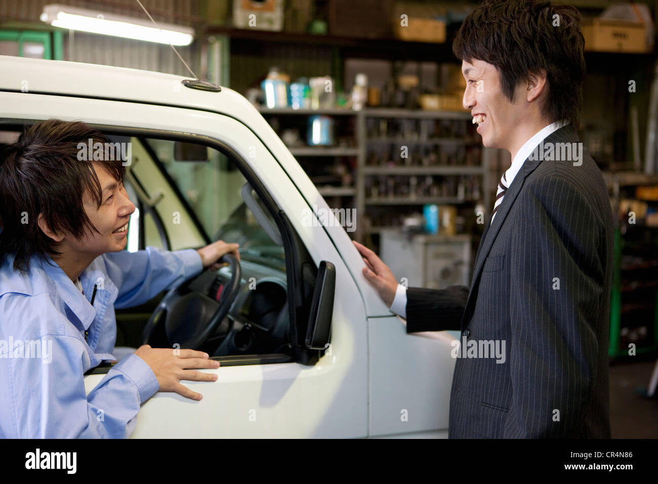 Car Mechanic Talking To Client Stock Photo Alamy