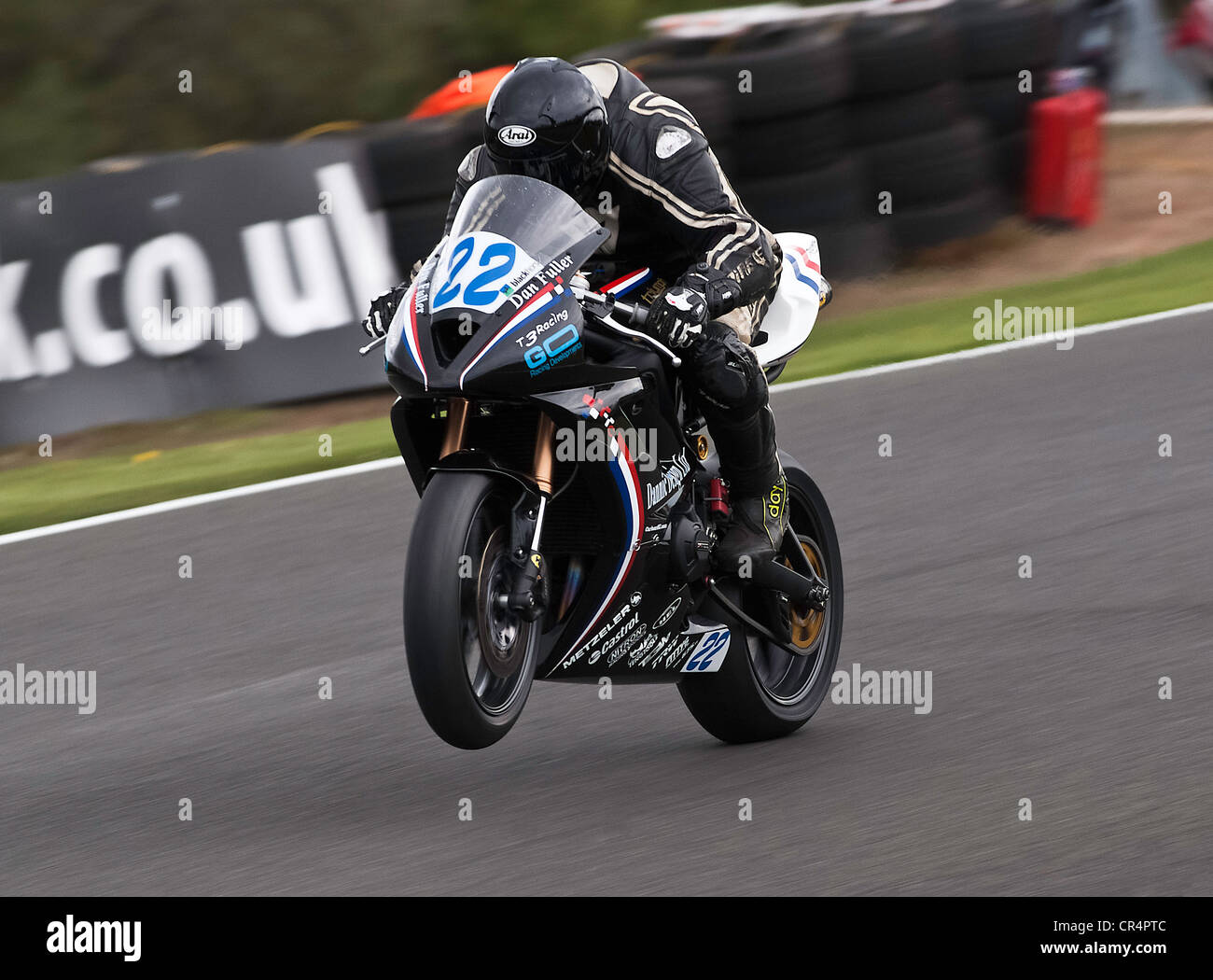 Dan Fuller Riding a Triumph Motorcycle Pulls a Wheelie at Oulton Park ...