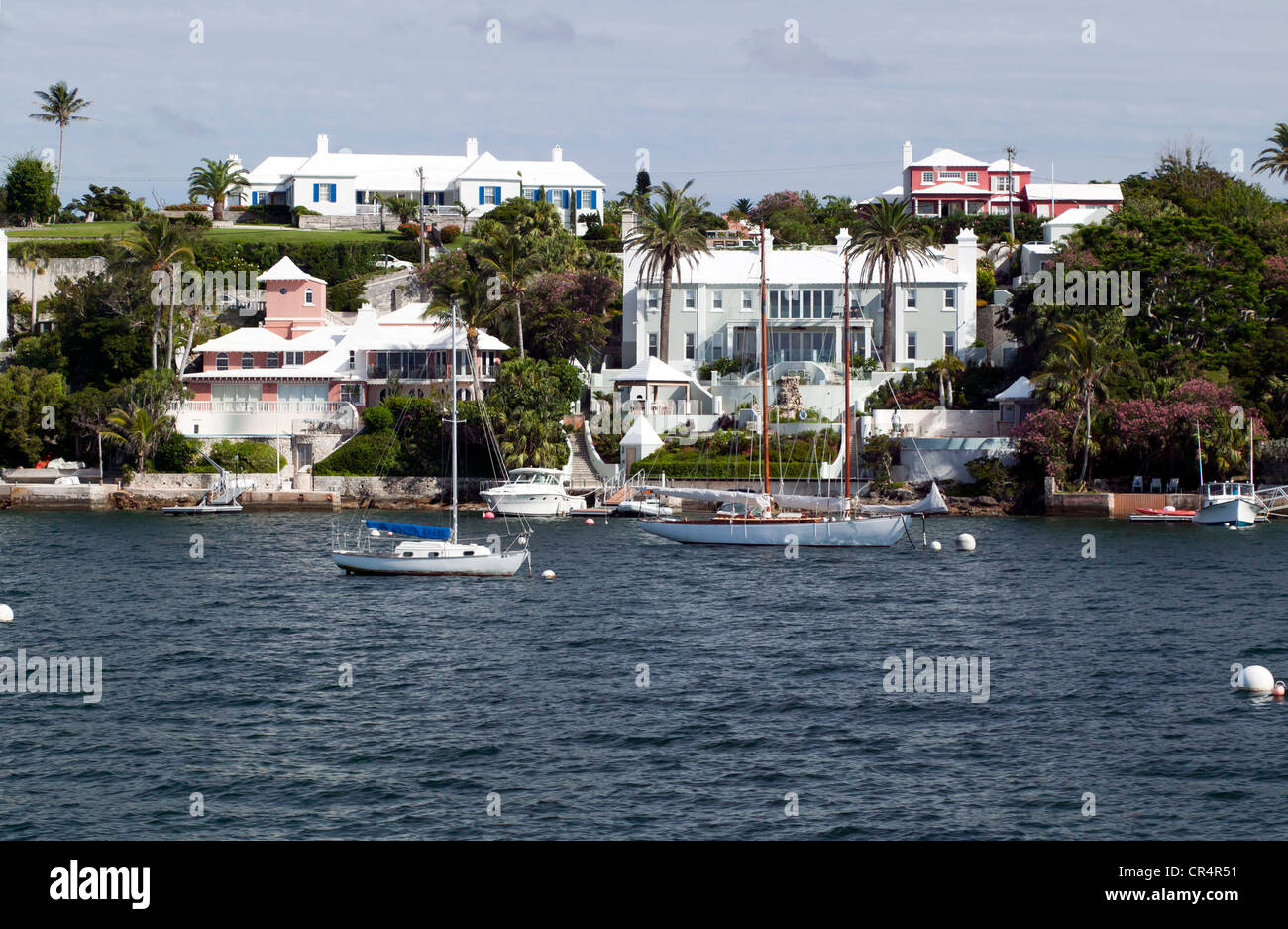 Tranquil moorings overlooked by houses on the hillside, Warwick Parish ...