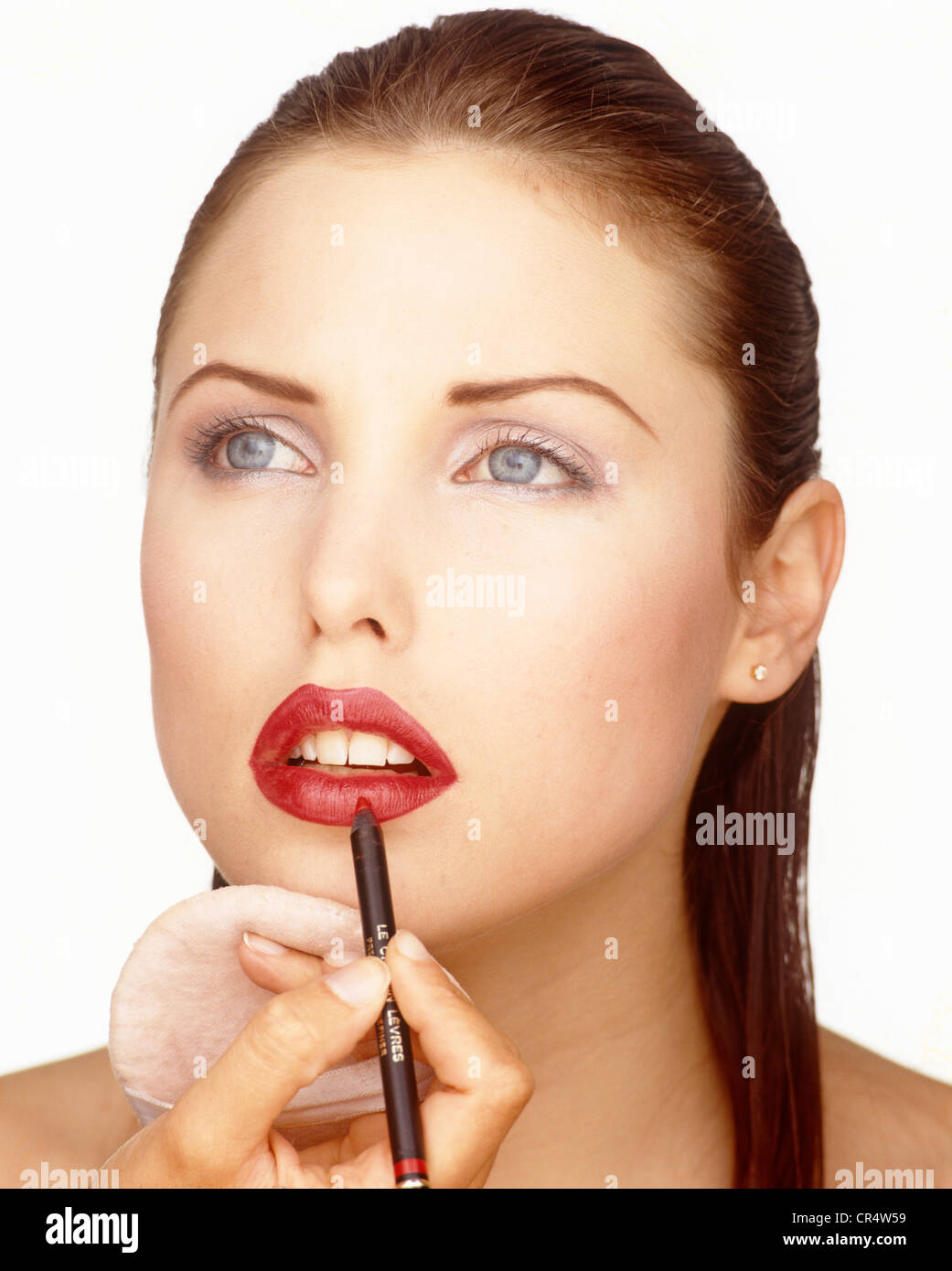 Close-up girl young woman applying make-up Stock Photo - Alamy