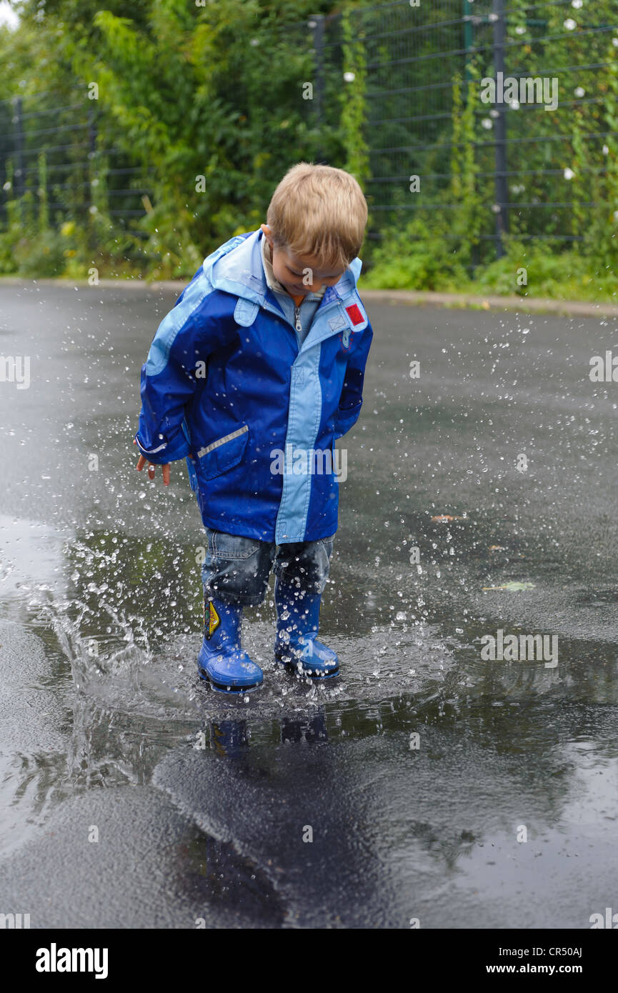 Boy Jumping In Puddle Stock Photos & Boy Jumping In Puddle Stock Images ...
