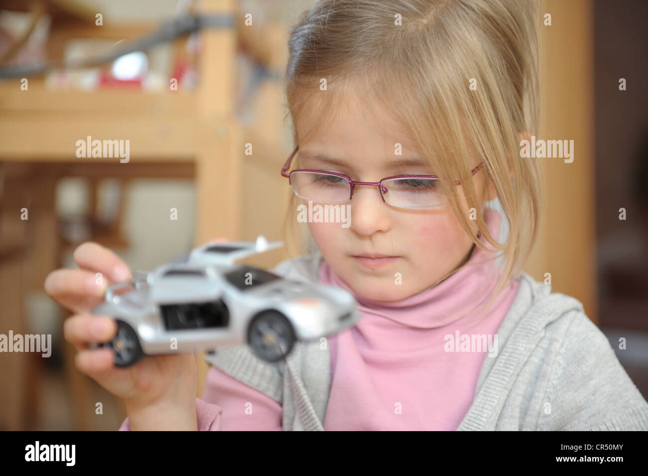 Girl playing cars toys hi-res stock photography and images - Alamy