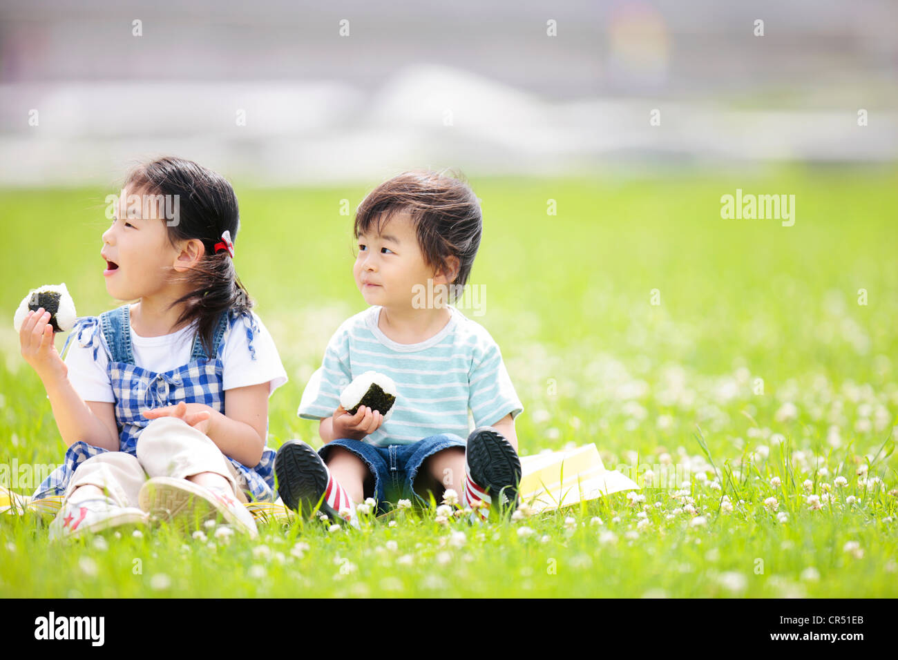 Boy eating rice ball hi-res stock photography and images - Alamy