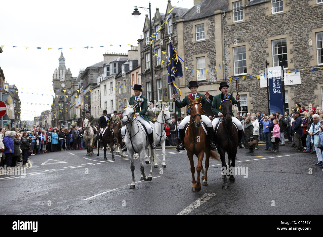 The Cornet and his supporters ride out on their procession around town ...
