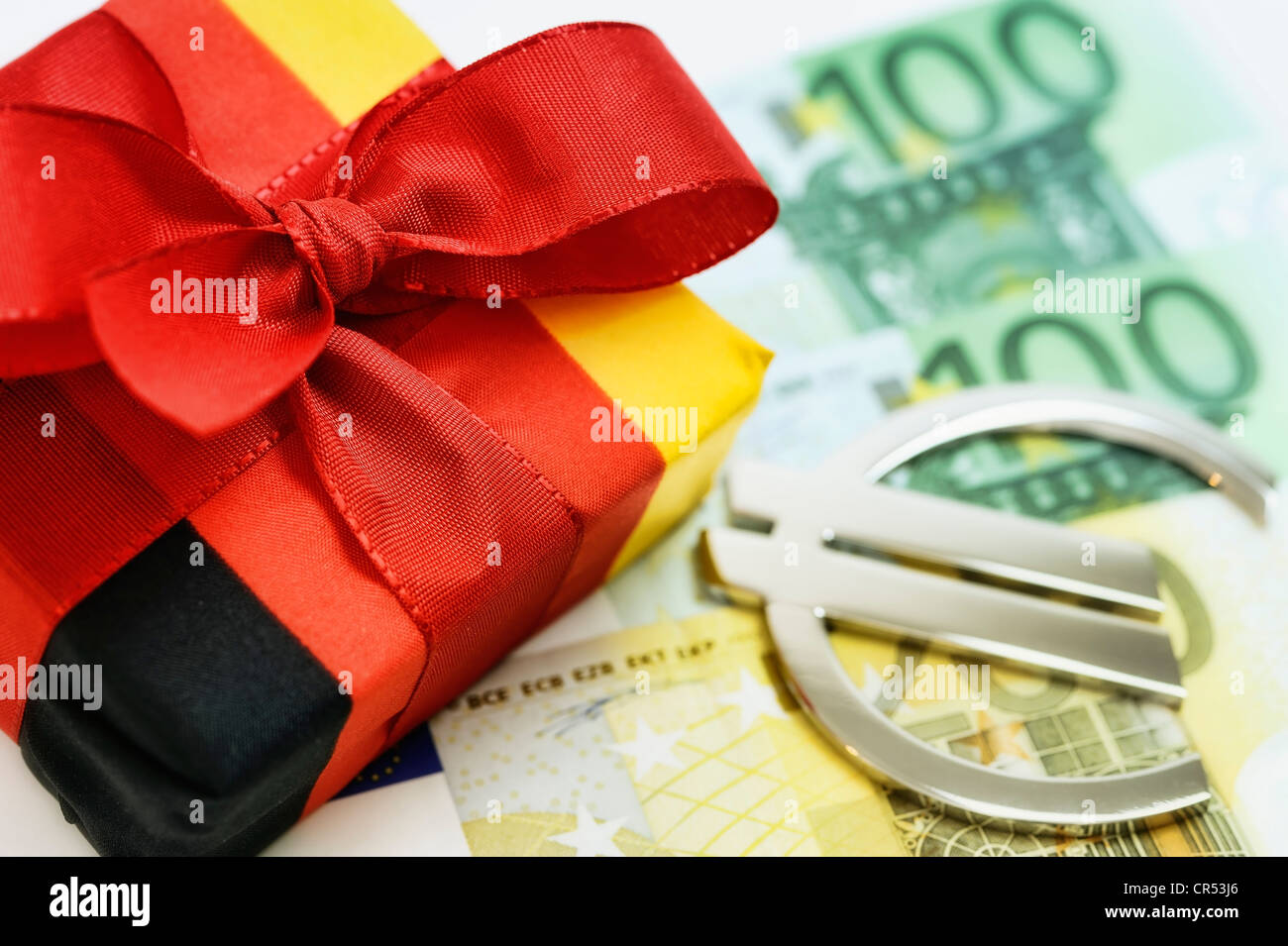 Present wrapped in the German national colours, euro symbol, euro ...
