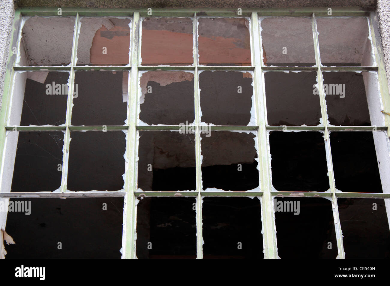 Broken window in derelict factory Stock Photo - Alamy
