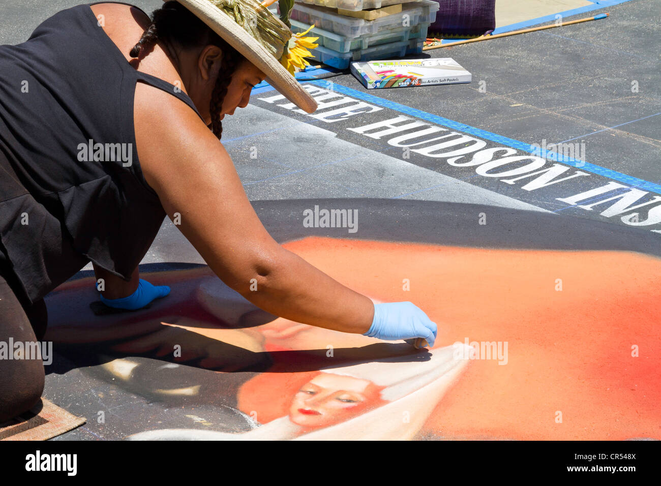 Artist doing chalk drawing on pavement in "Santa Barbara" California ...