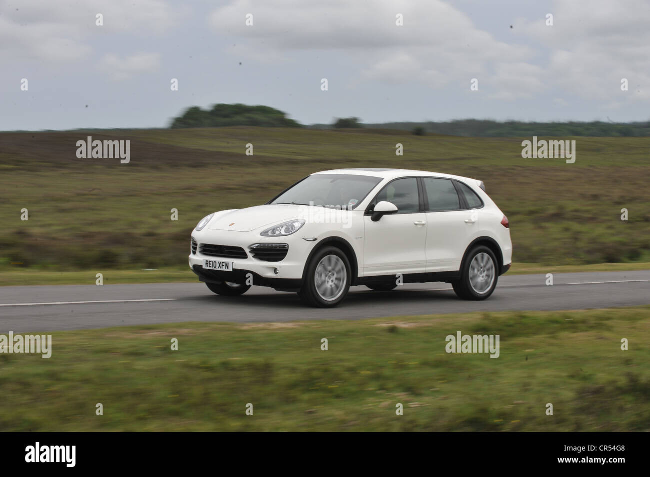 Porsche Cayenne hybrid performance SUV 4x4 driving Stock Photo - Alamy