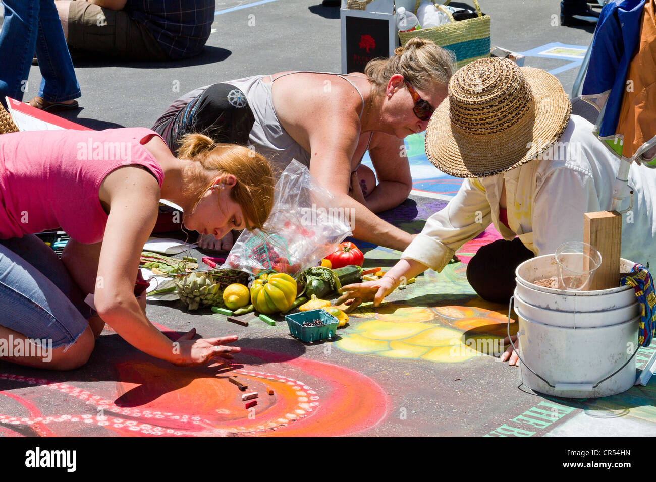 Artists doing chalk drawing on street in "Santa Barbara" California ...