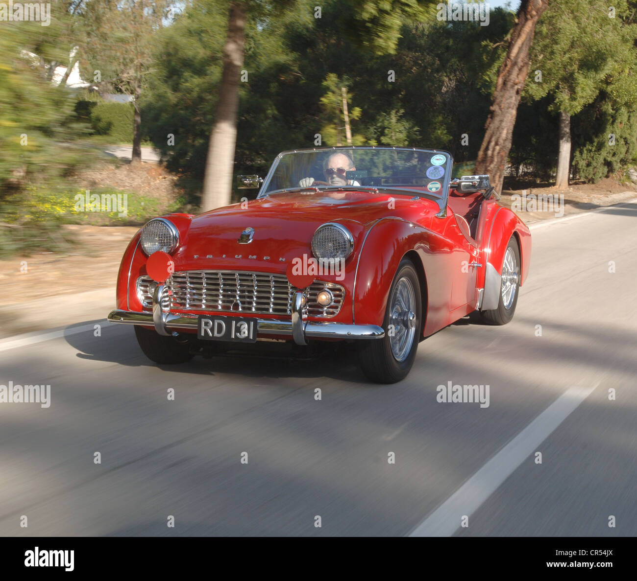 Triumph TR3 classic British open top sports car driving Stock Photo - Alamy