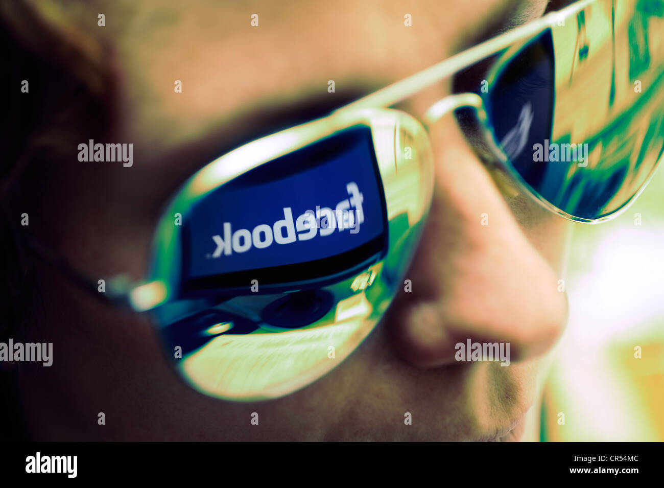 Facebook logo reflected in a pair of glasses Stock Photo - Alamy