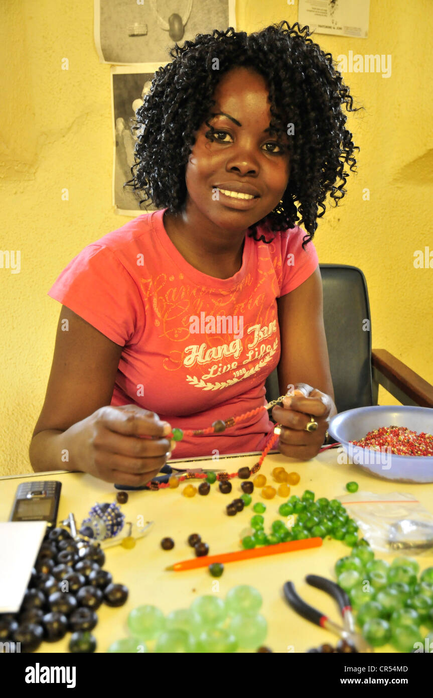 Woman working on a pearl necklace, Penduka project for woman in the ...