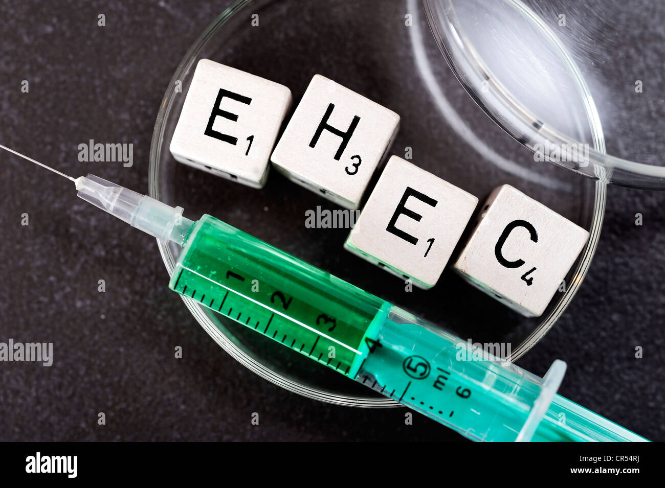 Lettering EHEC in a petri dish and syringe, symbolic image for EHEC ...