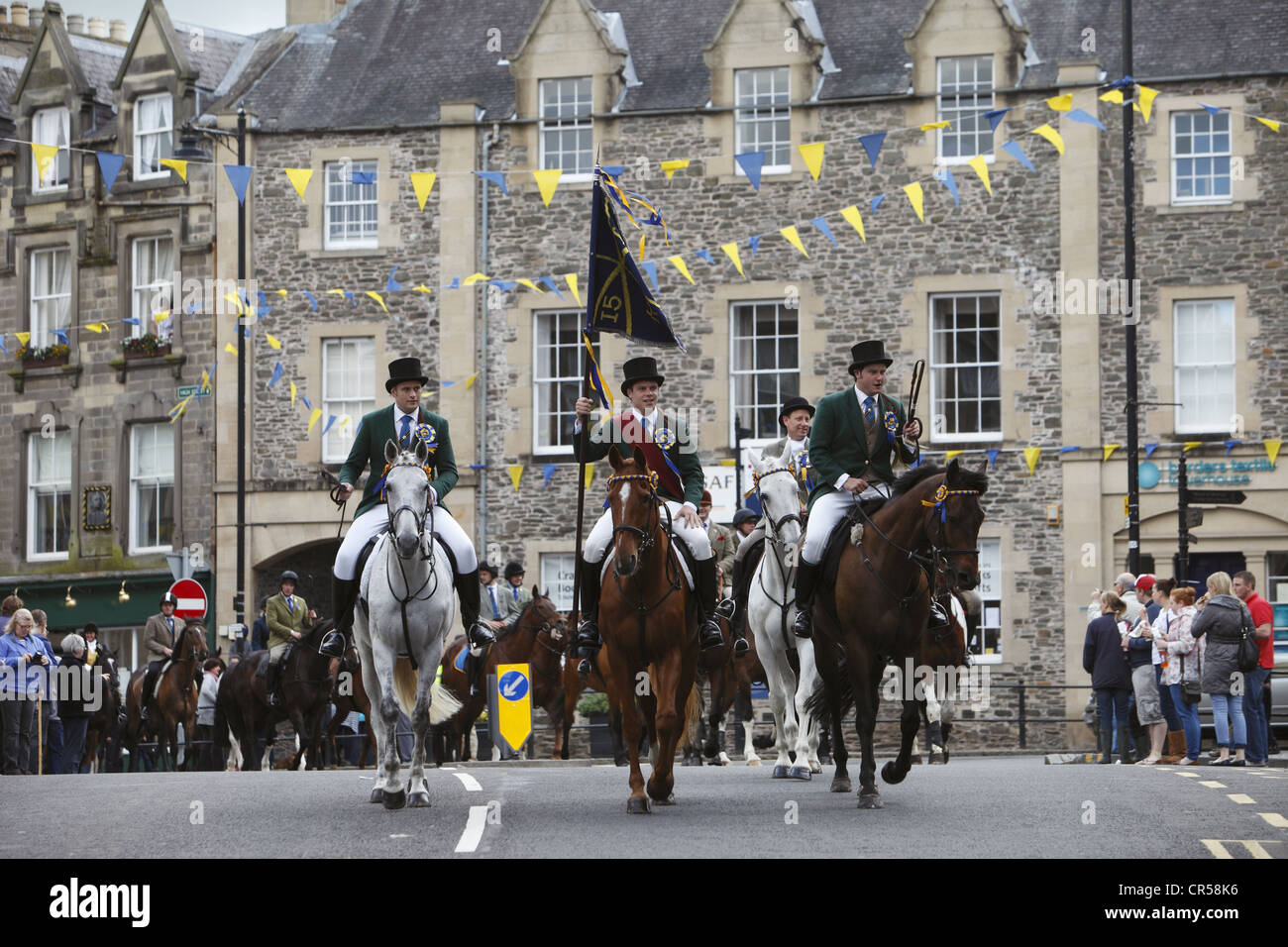 The Cornet and his supporters ride out on their procession around town ...