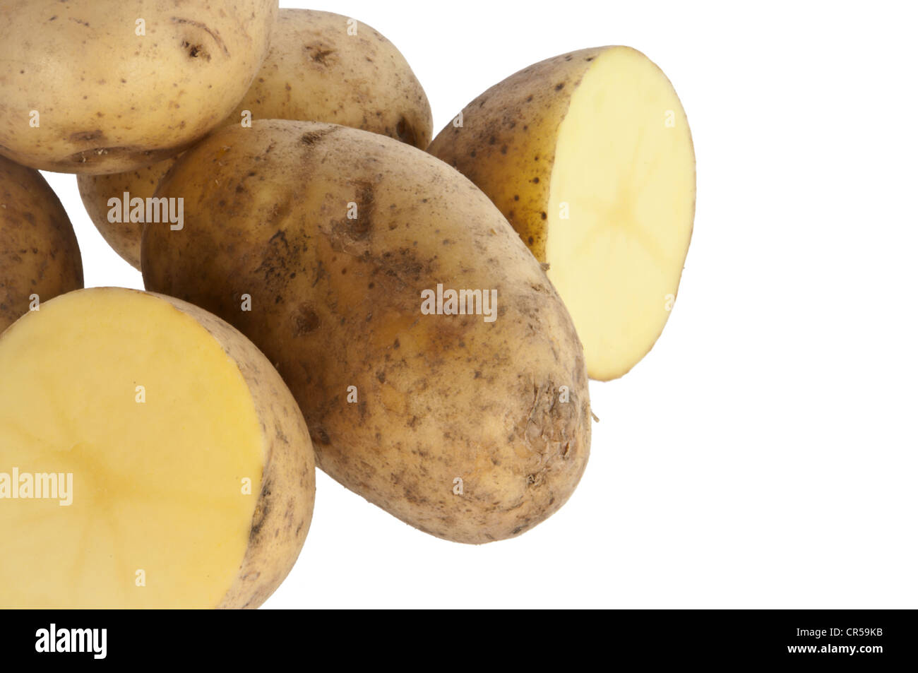 Heap of potatoes isolated on white background Stock Photo - Alamy