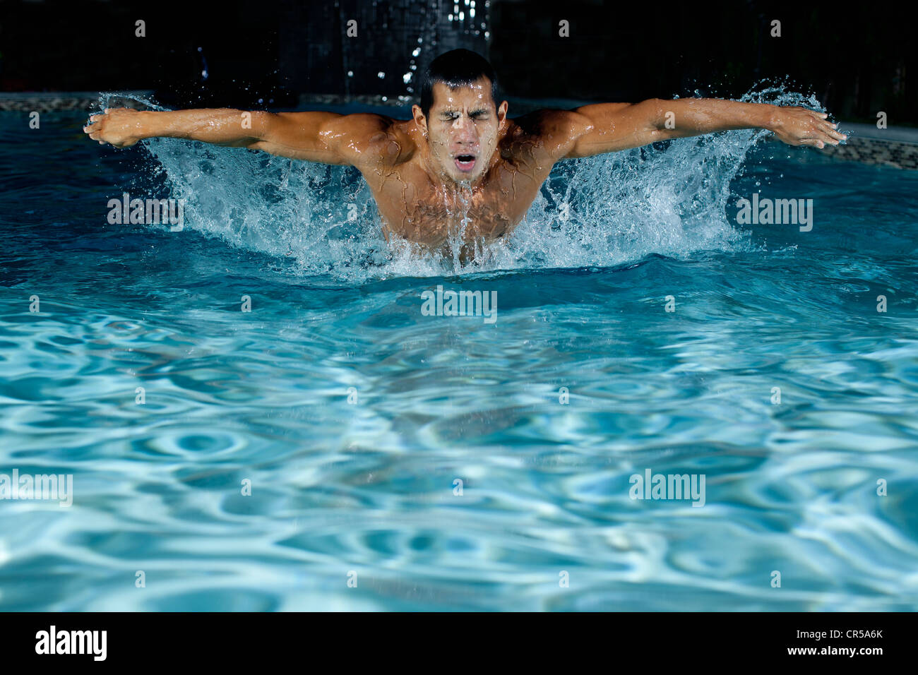Pacific Islander man swimming in swimming pool Stock Photo - Alamy