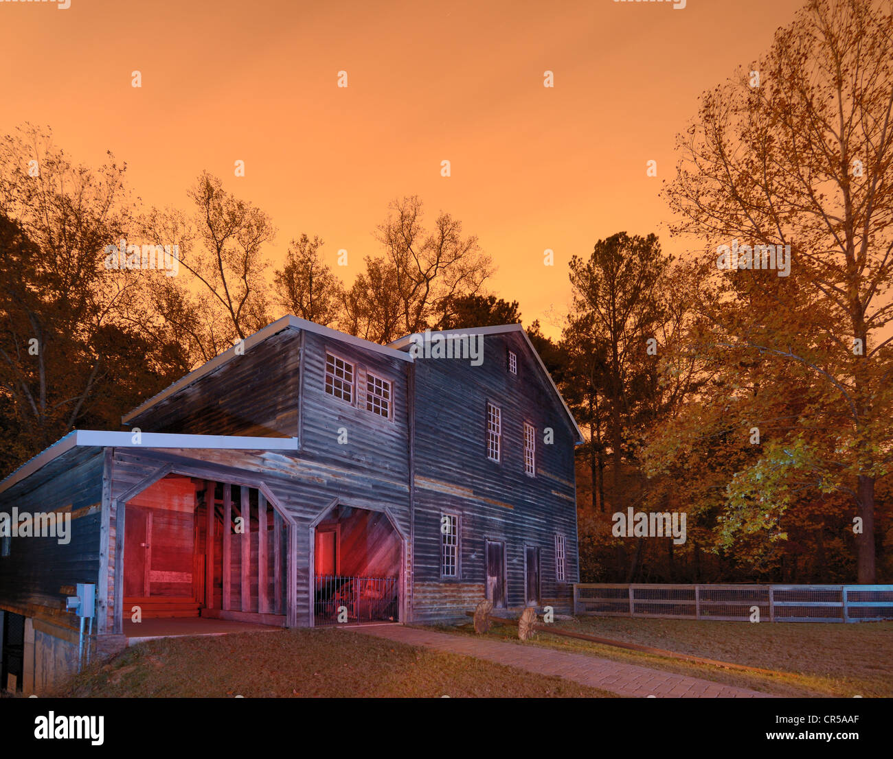 Old haunted mill under orange night skies with light painting Stock ...