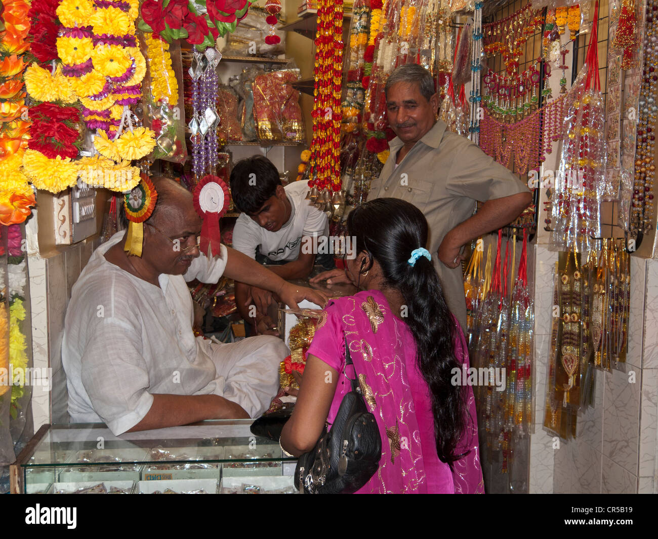 Shop with customers in the narrow streets of Old Delhi, Delhi, India ...