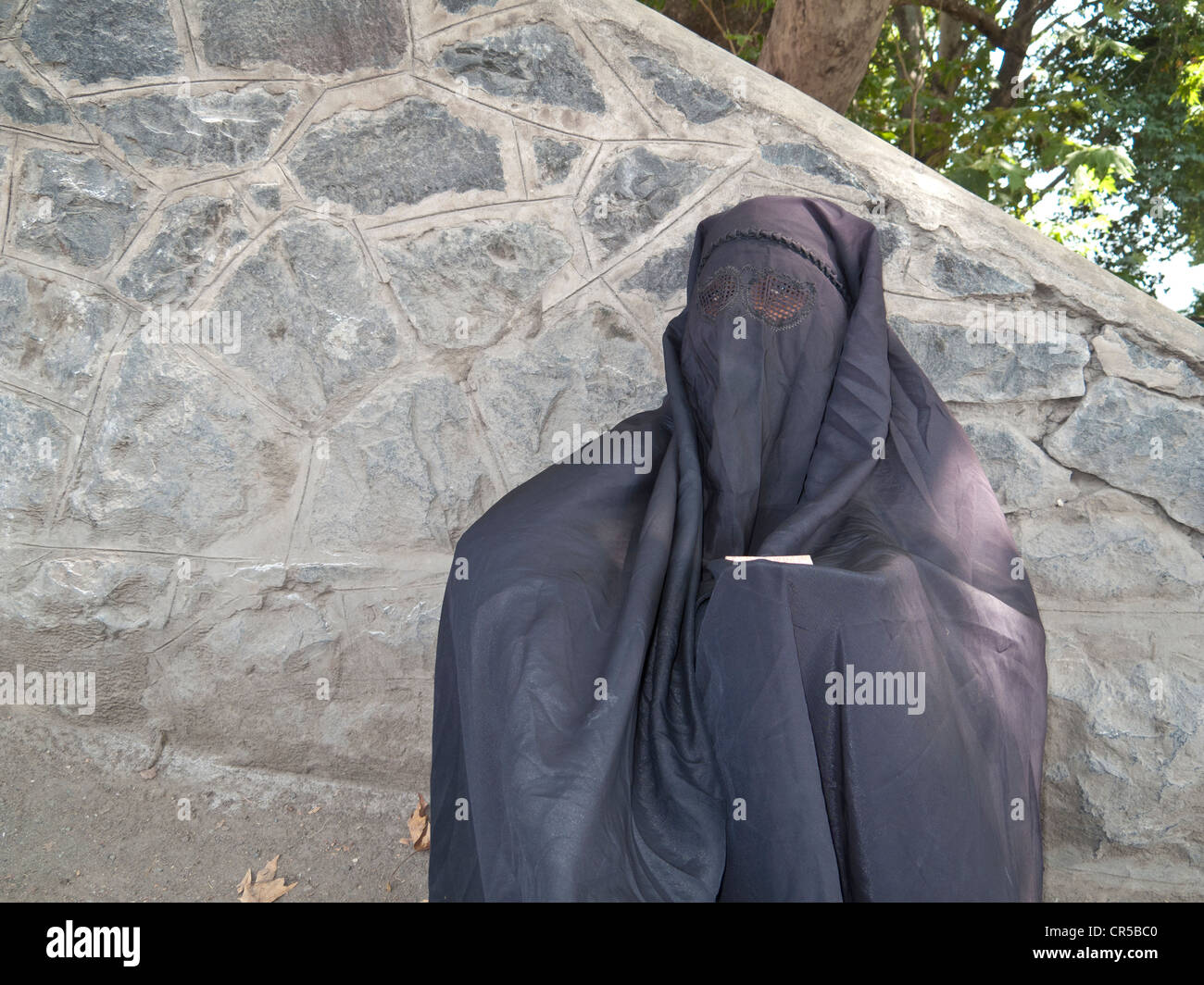 Muslim woman dressed in a burka, in traditional area of Srinagar, Jammu ...