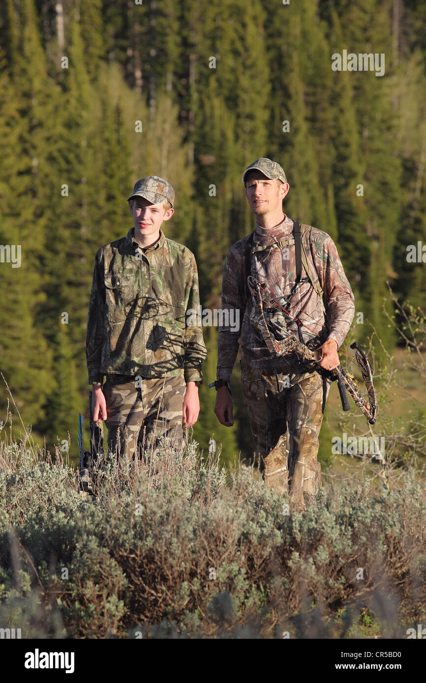 father and son hunting with archery equipment Stock Photo - Alamy