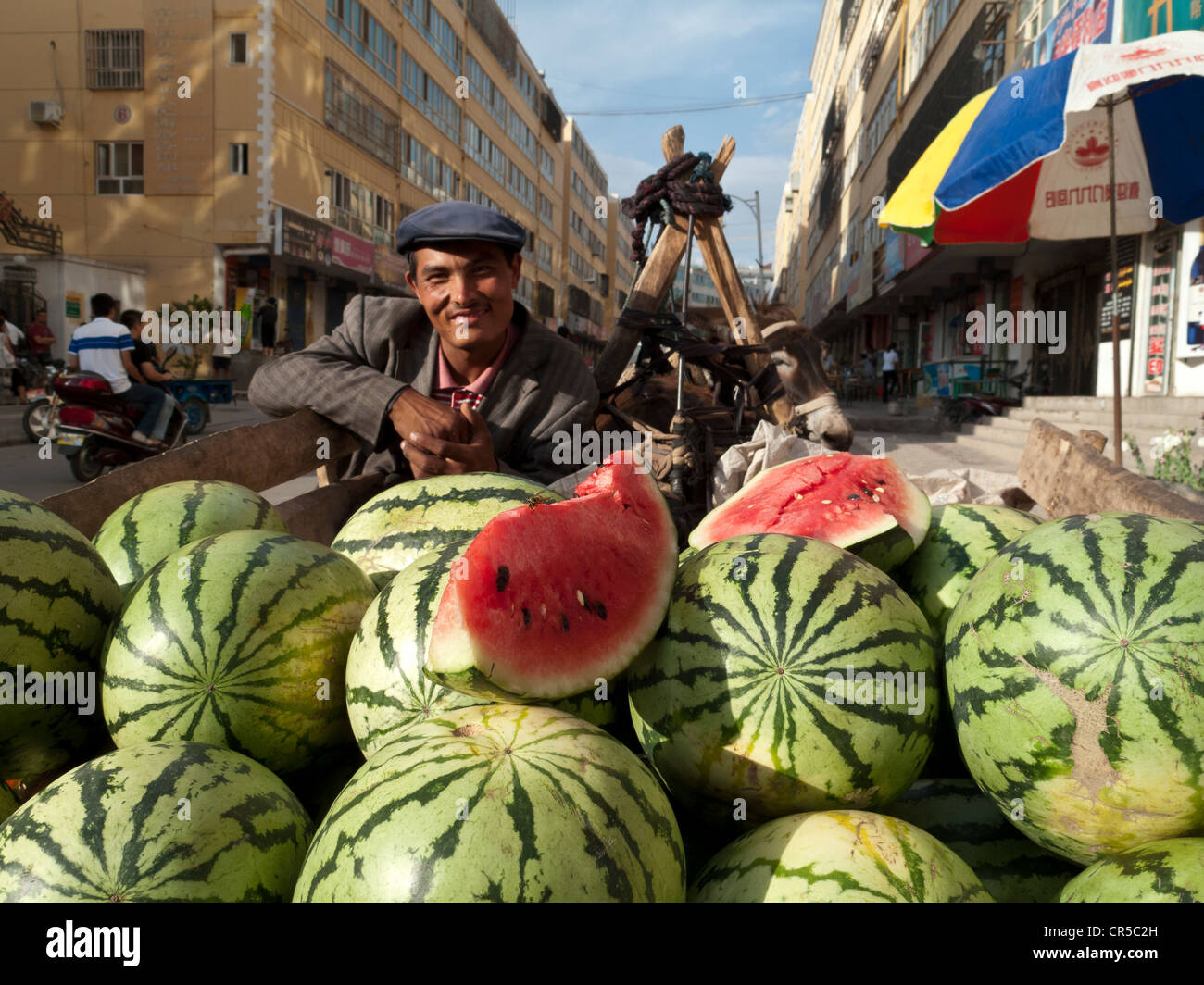 Melon seller in the streets of Kashgar, Xinjiang, China, Asia Stock ...
