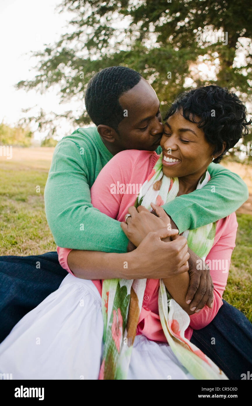 African couple holding hands kissing hi-res stock photography and ...