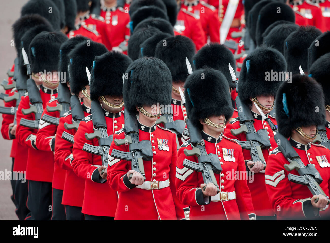 Soldiers from The Irish Guards Regiment marching past Buckingham Palace ...