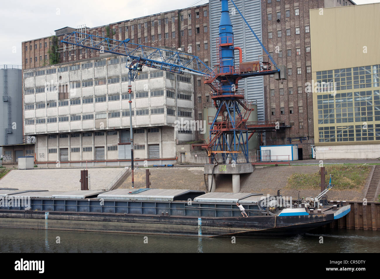 Barge delivering to the Walter Rau oil mill, Neuss harbour near ...