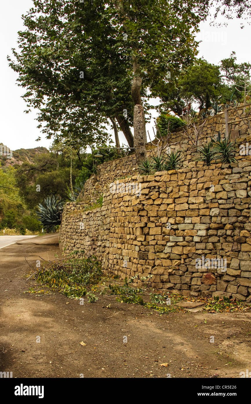 A large stacked stone retaining wall along California's Highway 33 ...