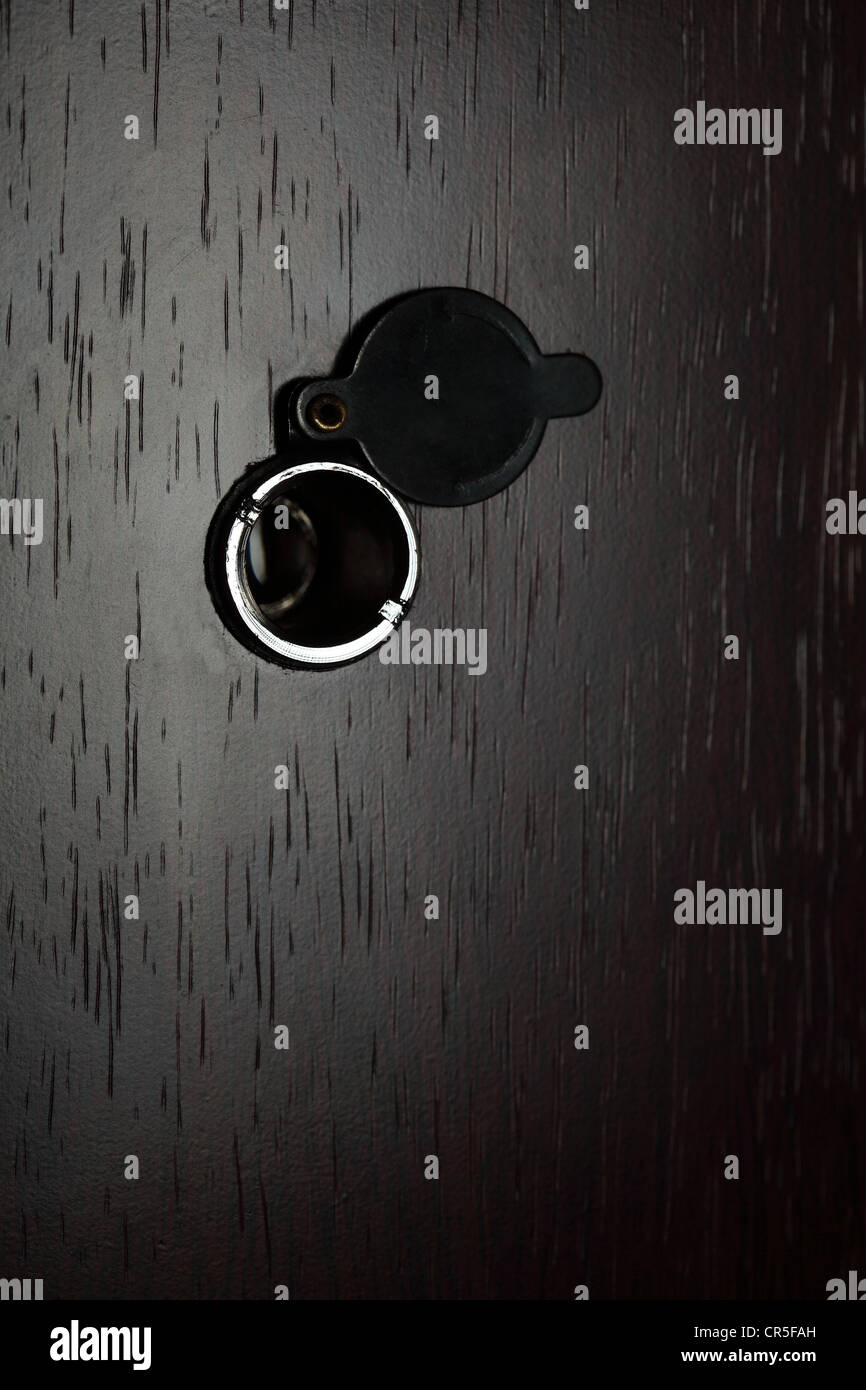 Peephole on wooden door - judas hole spyhole Stock Photo - Alamy