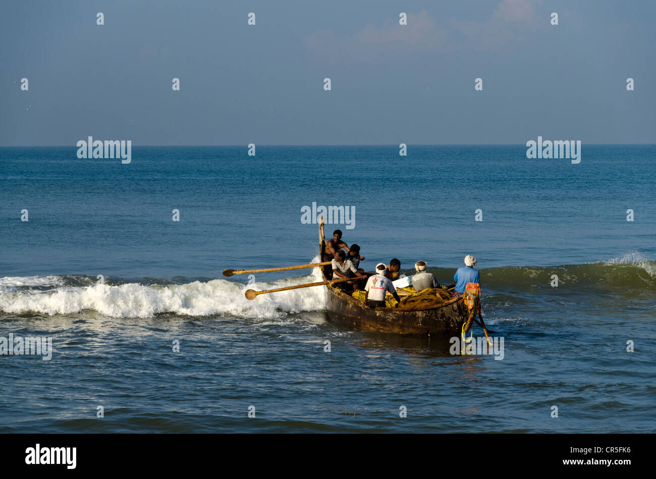 Fishermen fishing the traditional way, in a small village at the coast ...